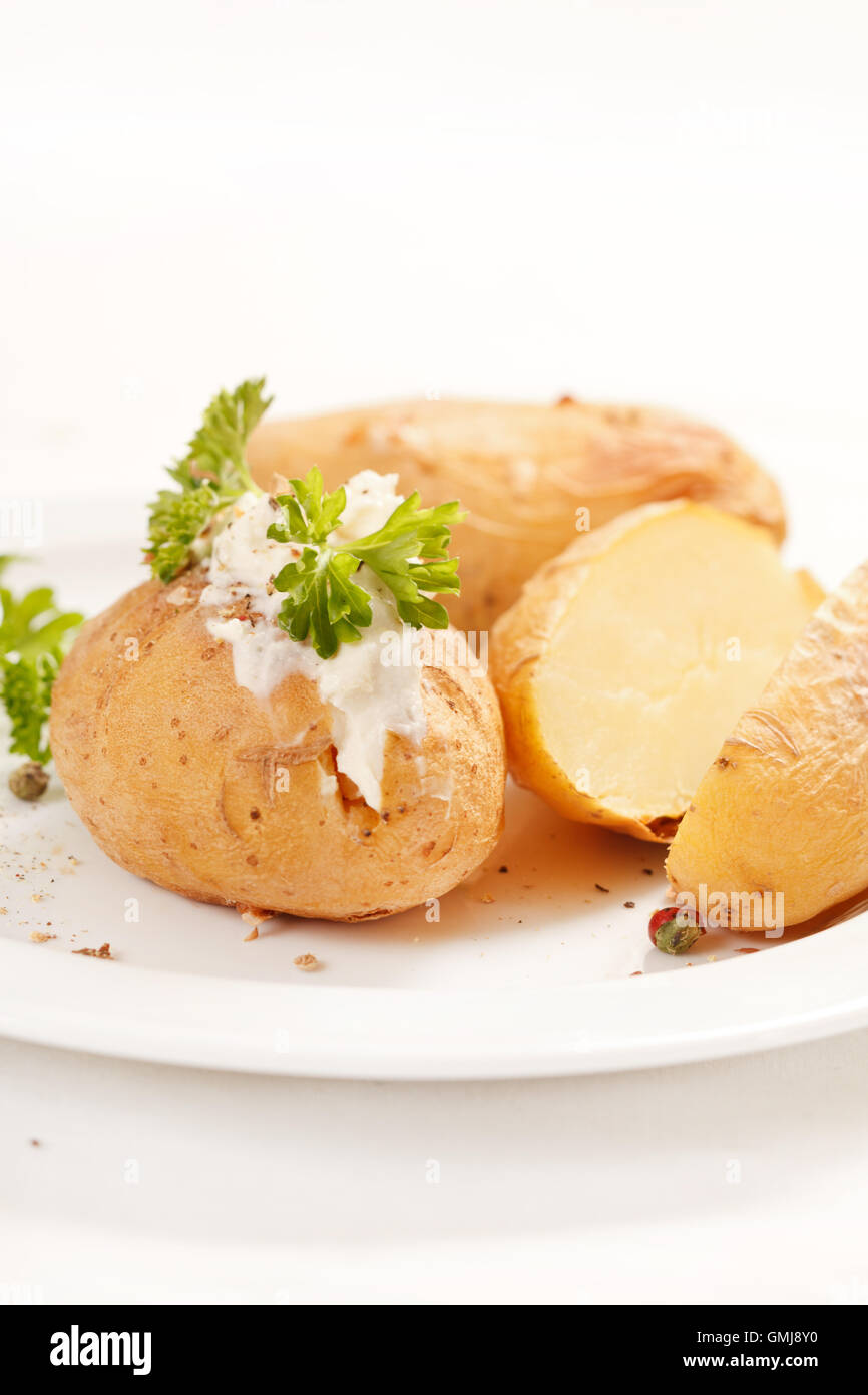 Baked potato filled with soft cheese Stock Photo - Alamy