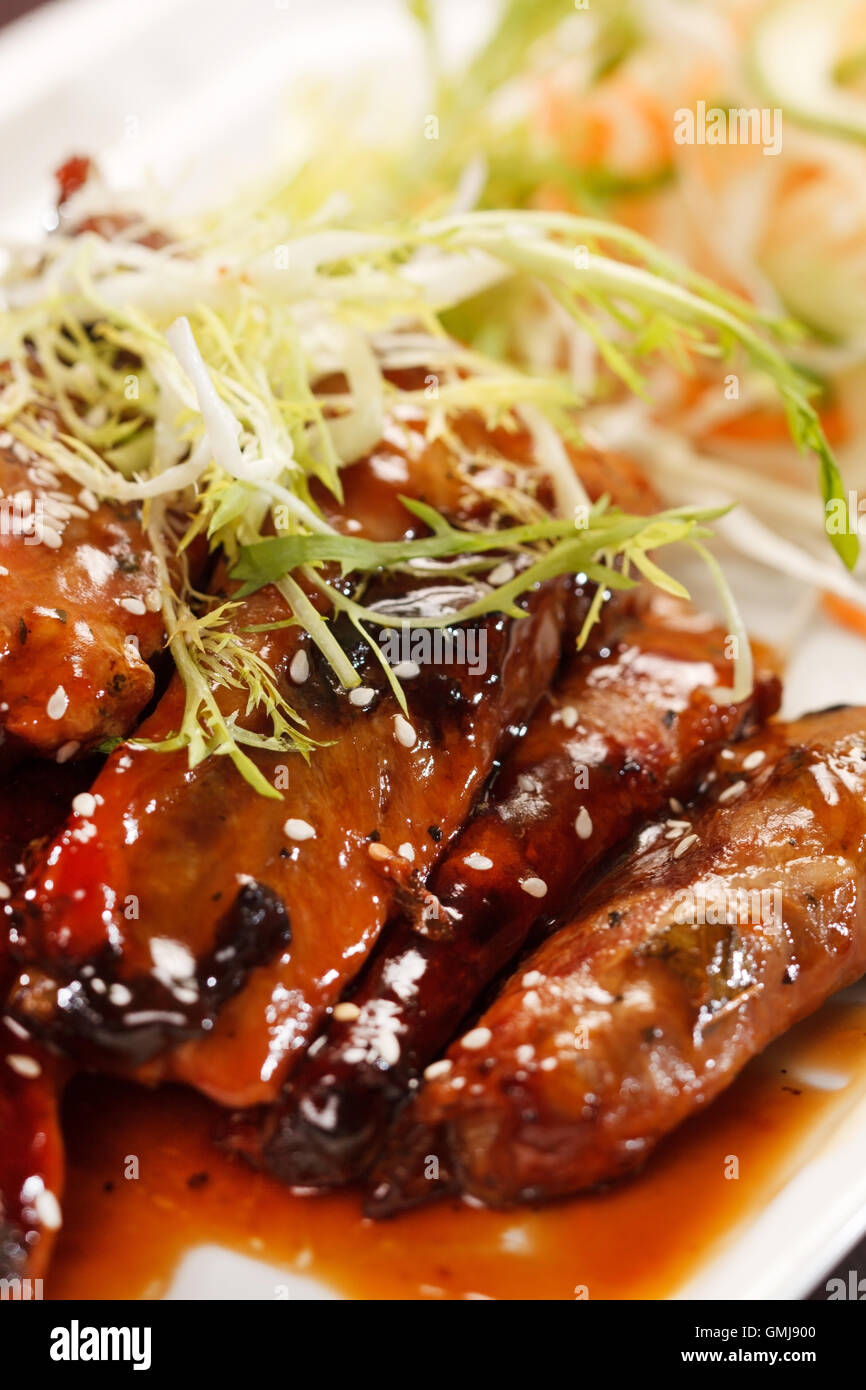 grilled ribs with salad Stock Photo - Alamy