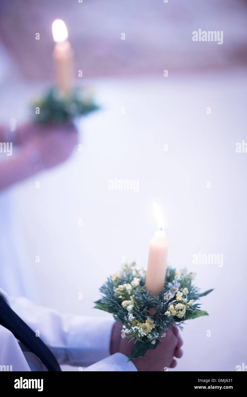 Catholic first communion religious ceremony boy in white shirt holding ...