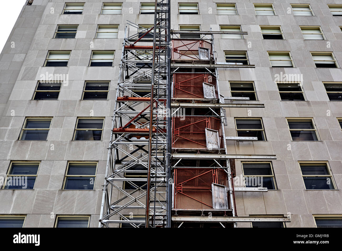 High rise building with scaffolding system for renovations Stock Photo ...