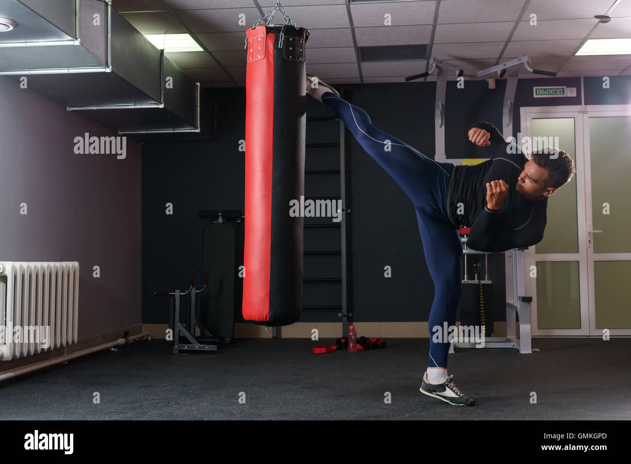 Training time. Image of muscular man boxing at gym Stock Photo - Alamy