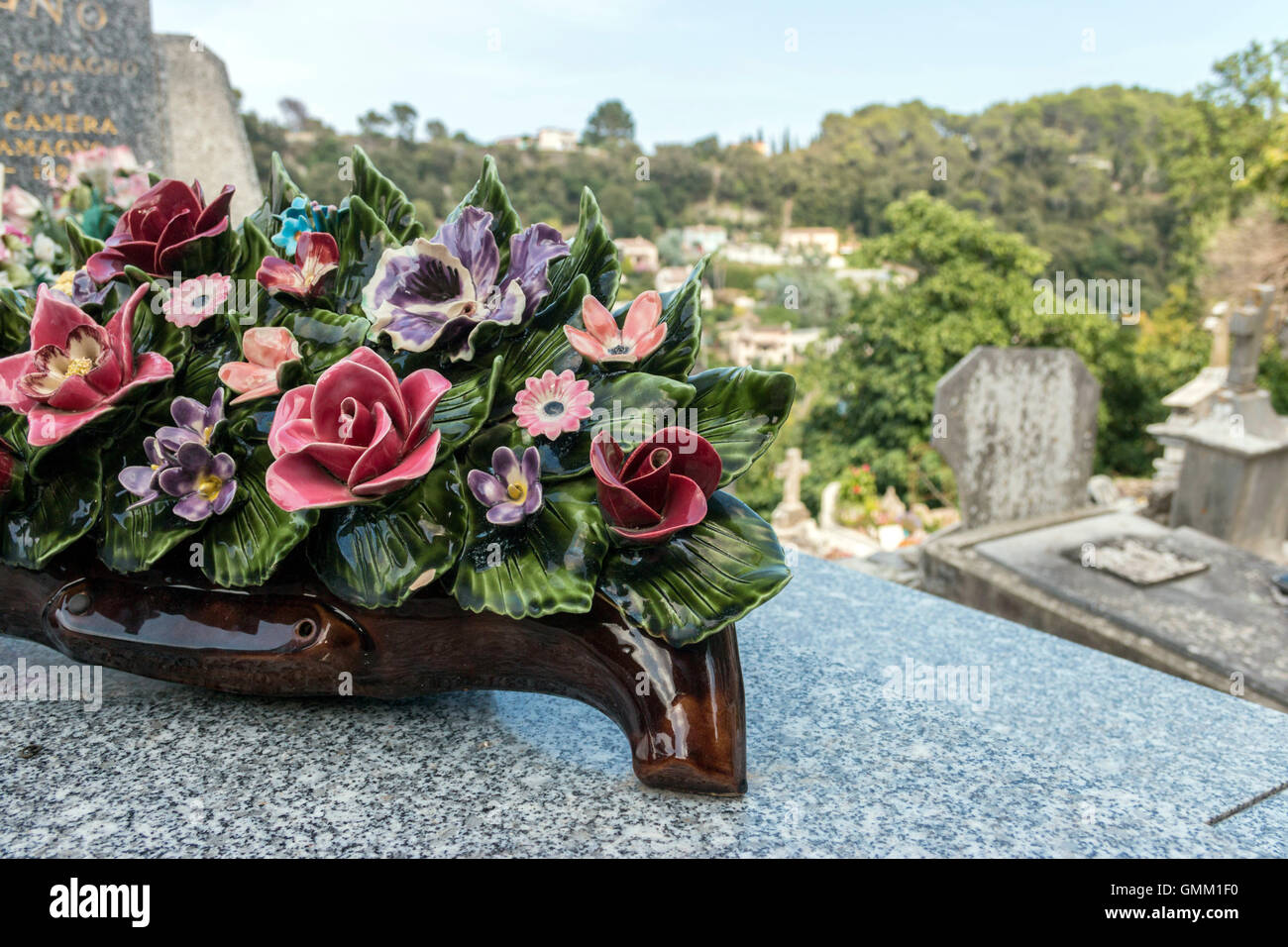 ceramic bouquet of flowers on a grave in a French cemetery Stock Photo ...