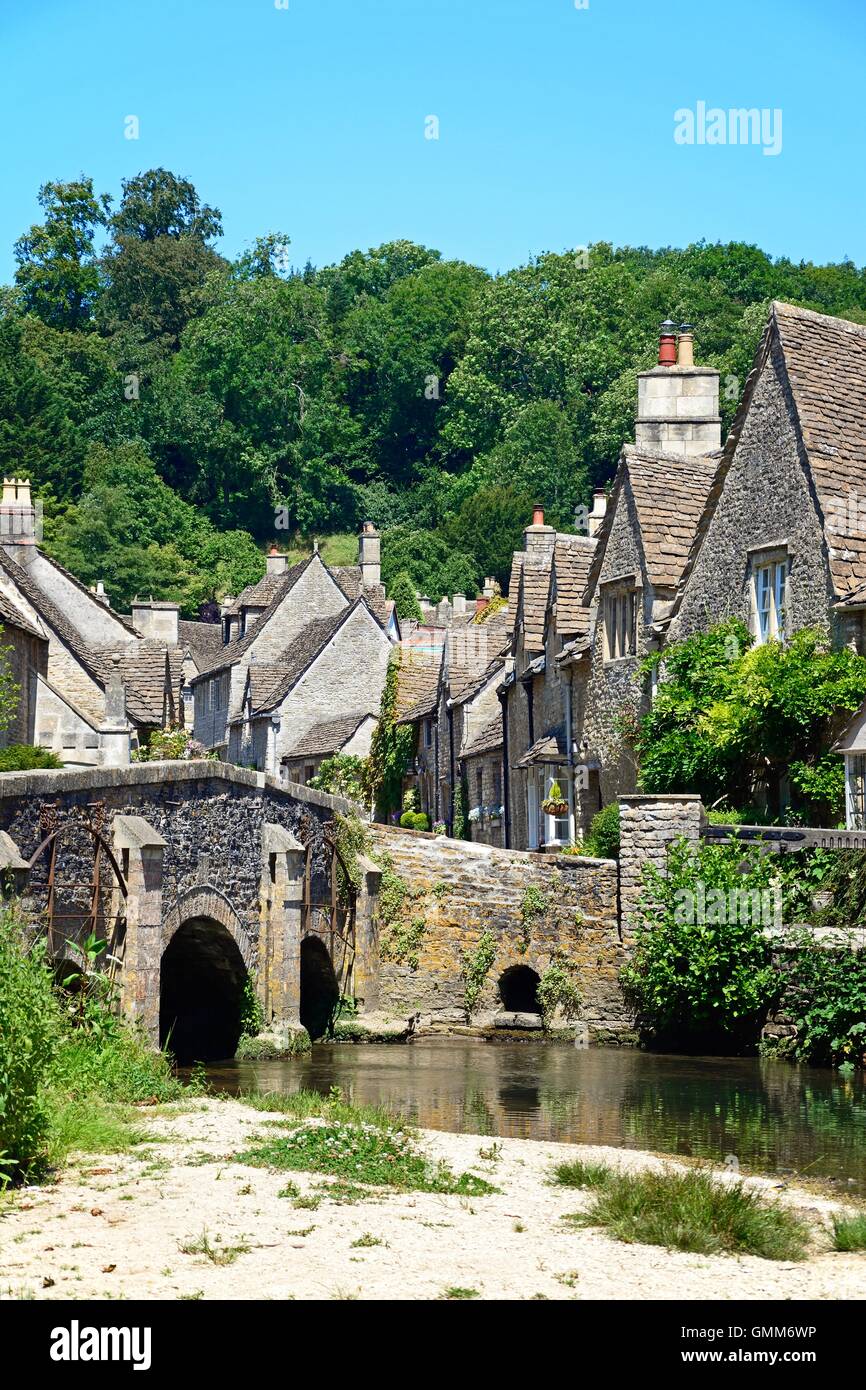 Stone bridge over the river Bybrook with cottages to the rear, Castle ...
