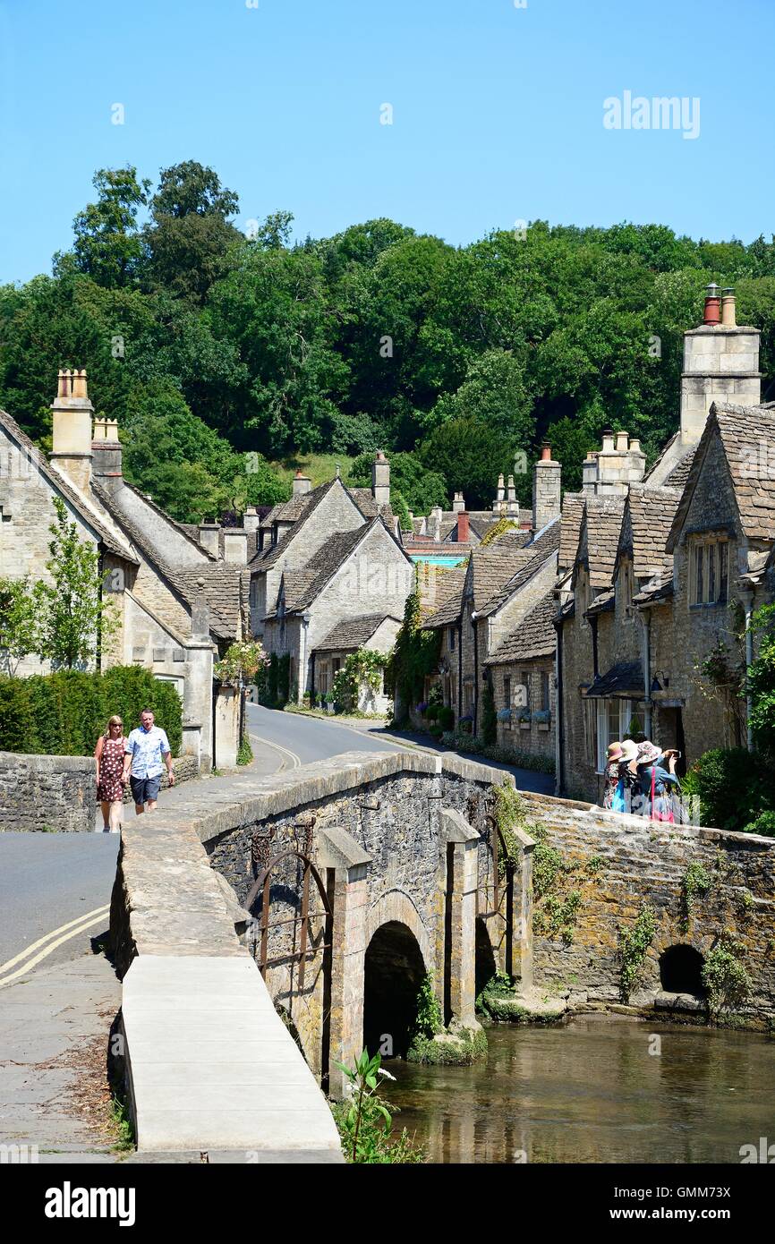 Stone bridge over the river Bybrook with cottages to the rear, Castle ...