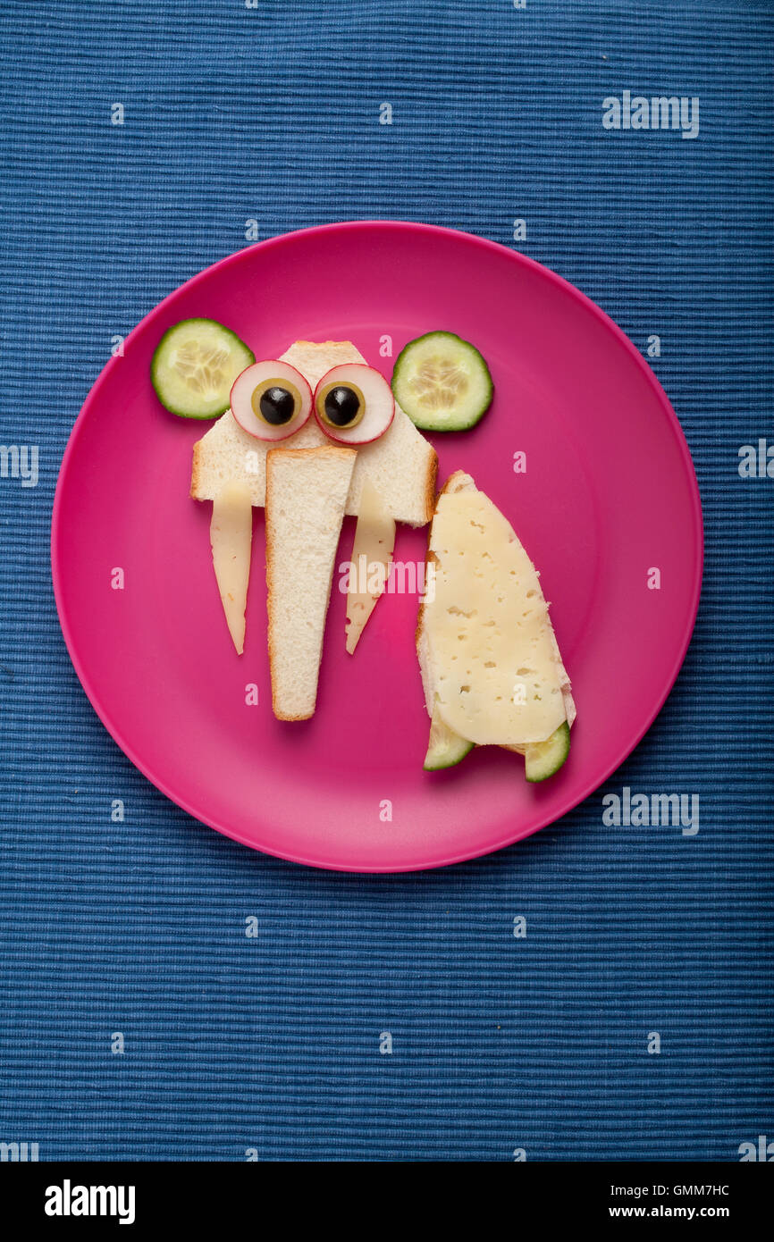 Funny sandwich elephant made on plate and fabric background Stock Photo ...
