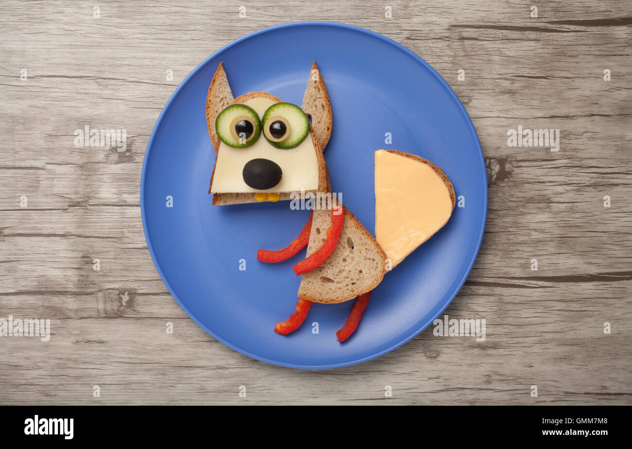 Squirrel made of bread and vegetables on plate and desk Stock Photo - Alamy