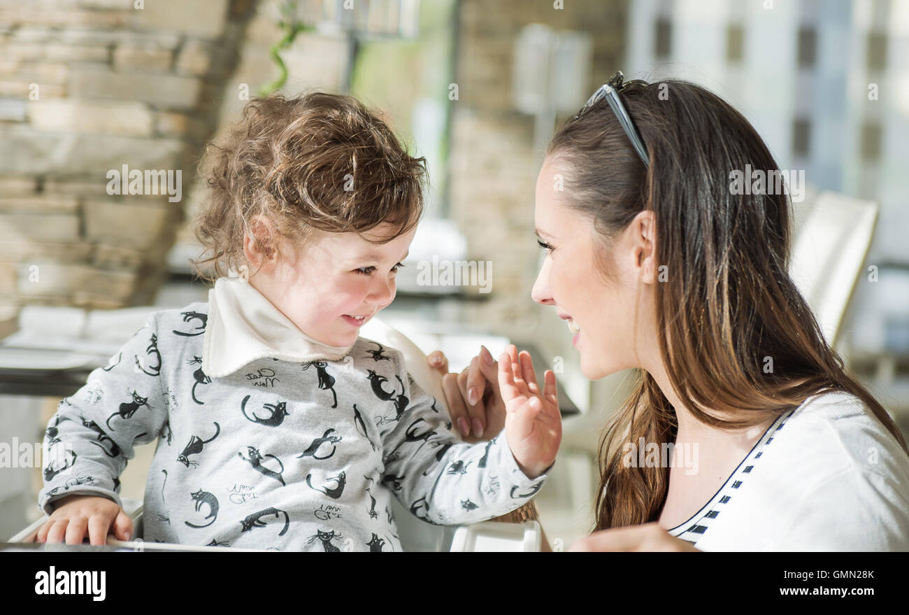 Happy mother and her little daughter having good time Stock Photo - Alamy