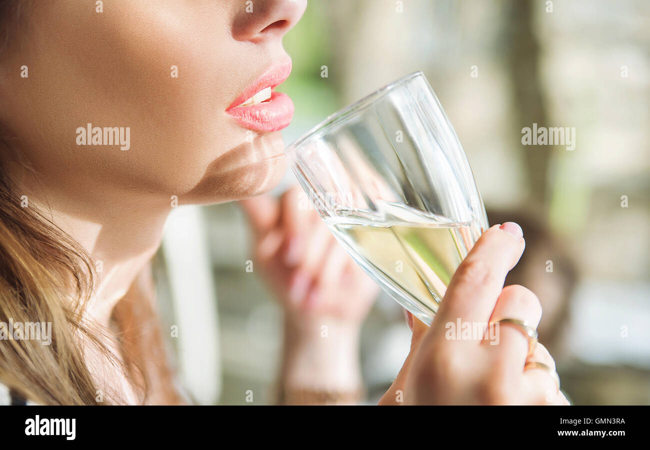 Closeup portrait of a young customer drinking white wine Stock Photo ...