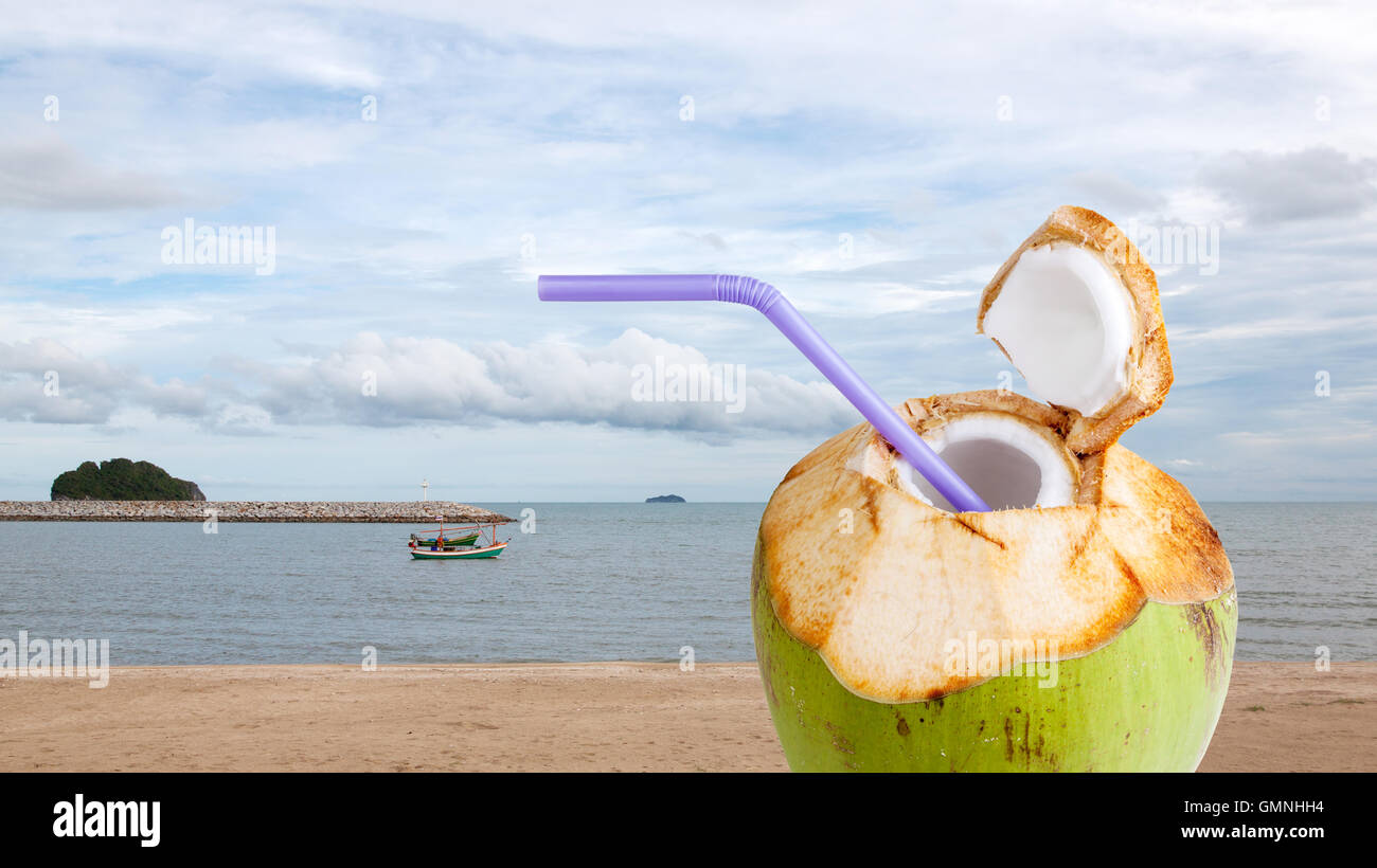Coconut Water Drink Fresh on sea side background Stock Photo - Alamy