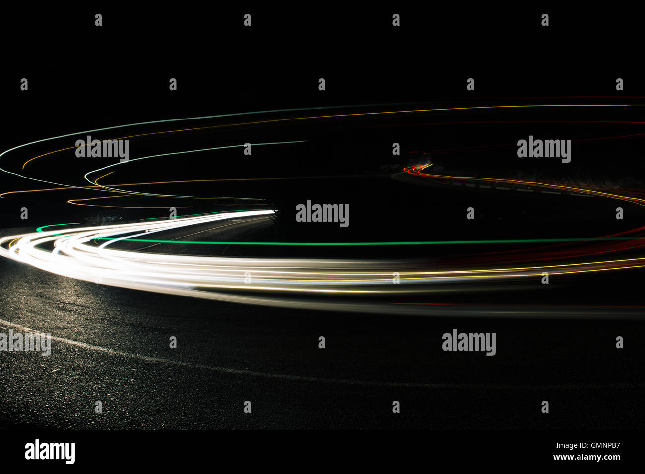 Bright car lines on night road Stock Photo - Alamy
