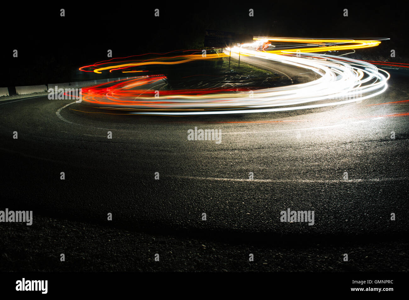 Bright car lines on night road Stock Photo - Alamy
