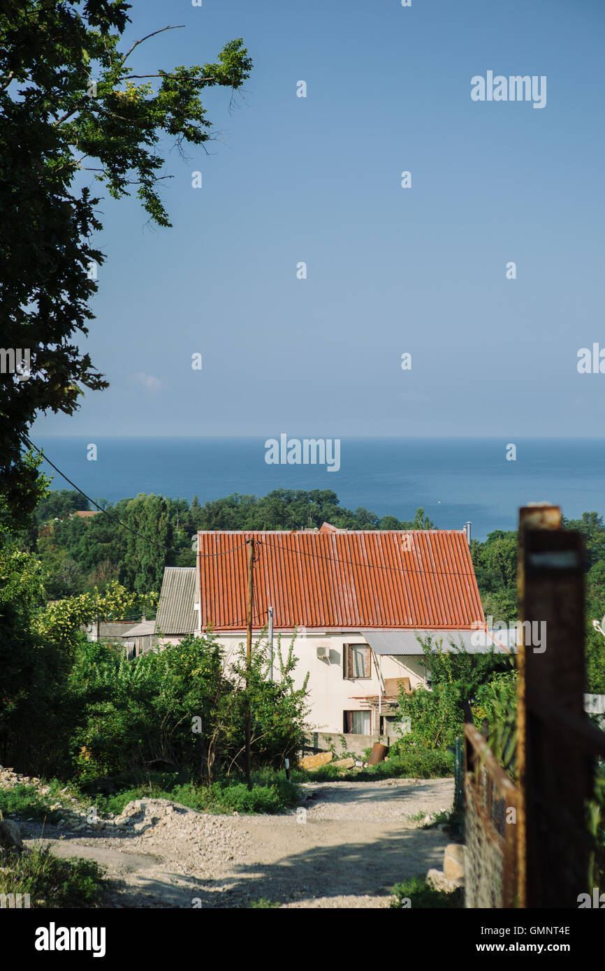 Rural house in countryside against of sea Stock Photo - Alamy
