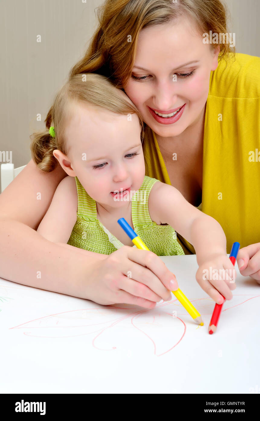 Mother and child painting Stock Photo - Alamy