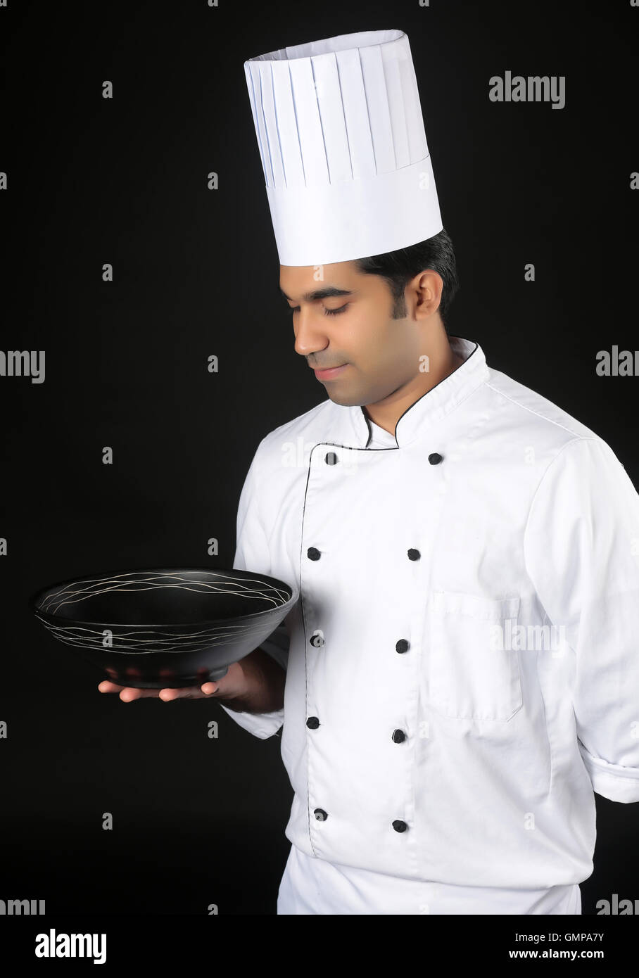 cooking, profession and people concept - happy male indian chef in ...