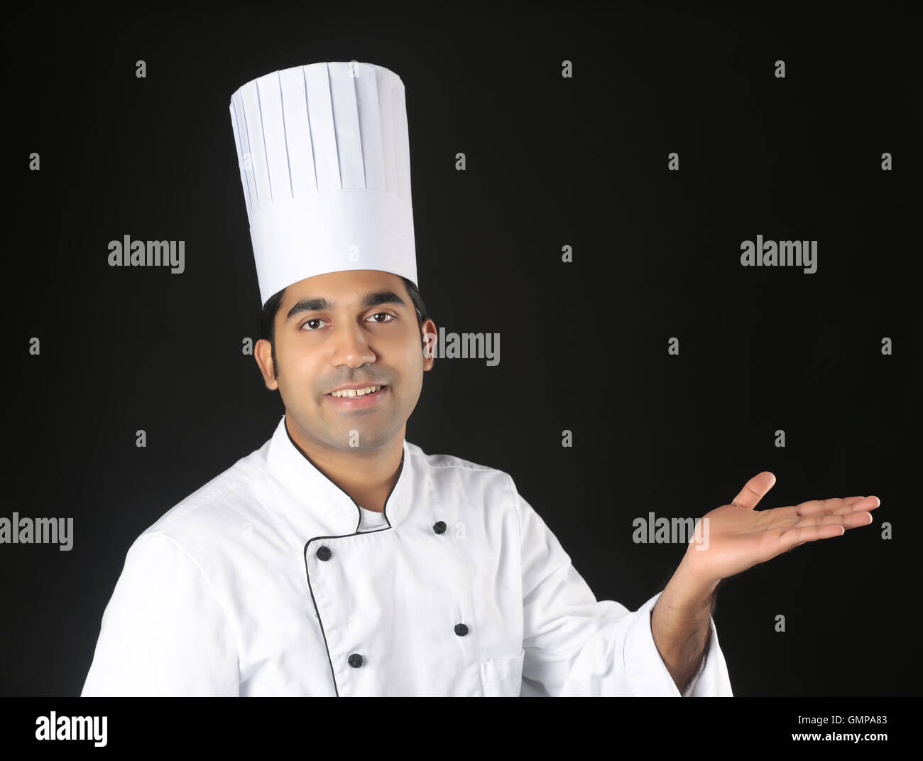 cooking, profession and people concept - happy male indian chef in ...