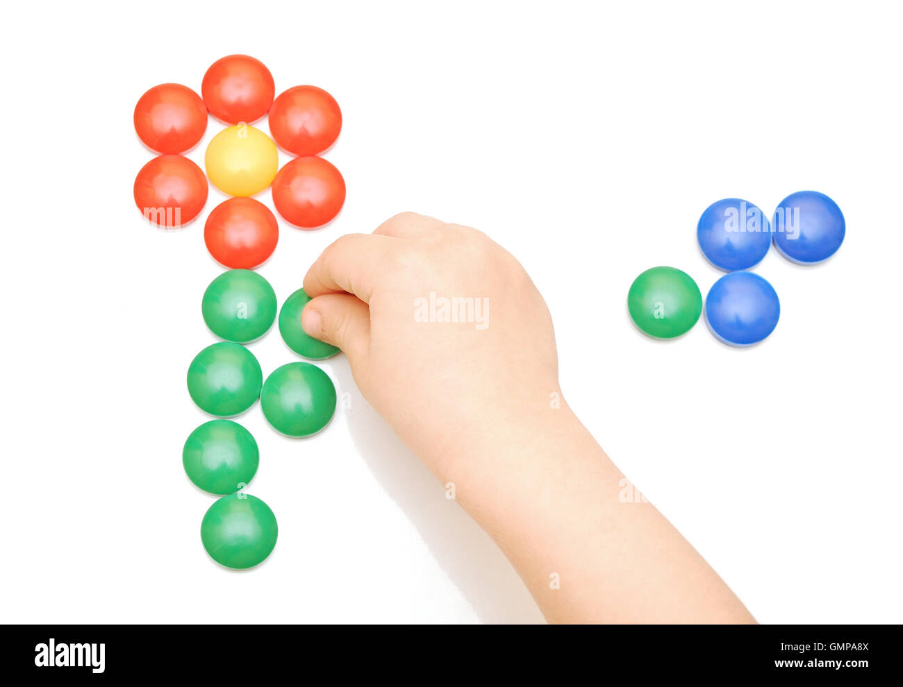 Hand and toy button on white background Stock Photo - Alamy