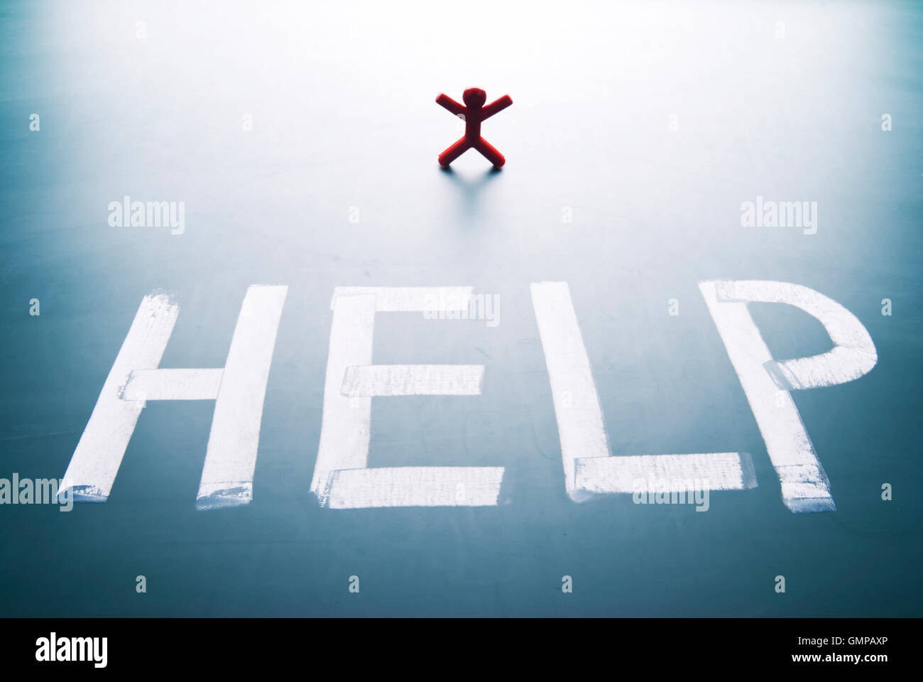 Heip word and single person with backlight shadow Stock Photo - Alamy