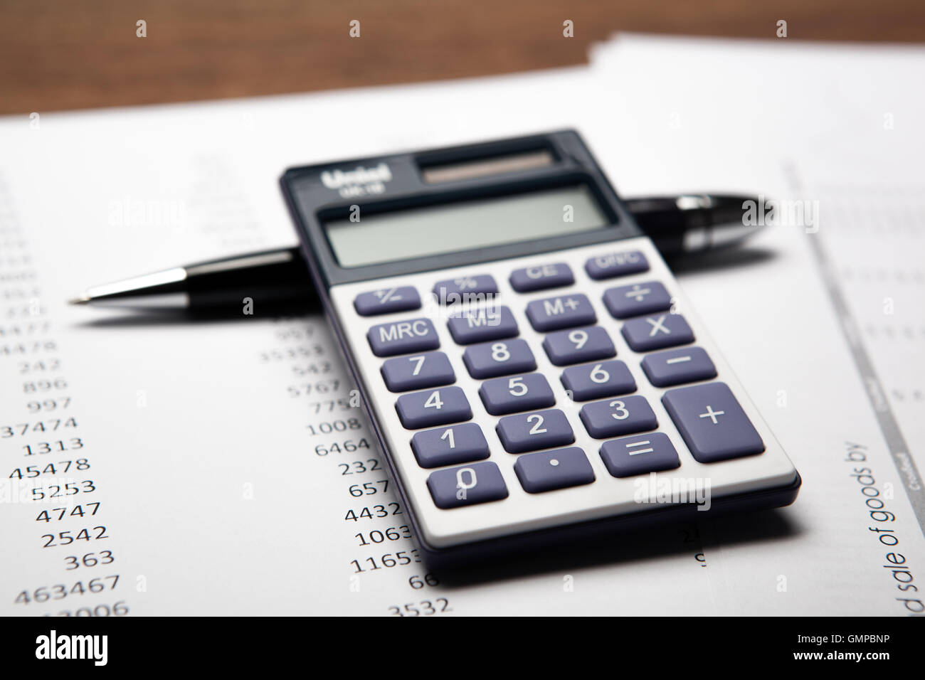 work on the calculator and papers Stock Photo - Alamy