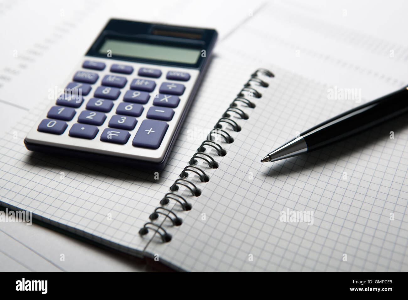 work on the calculator and papers Stock Photo - Alamy