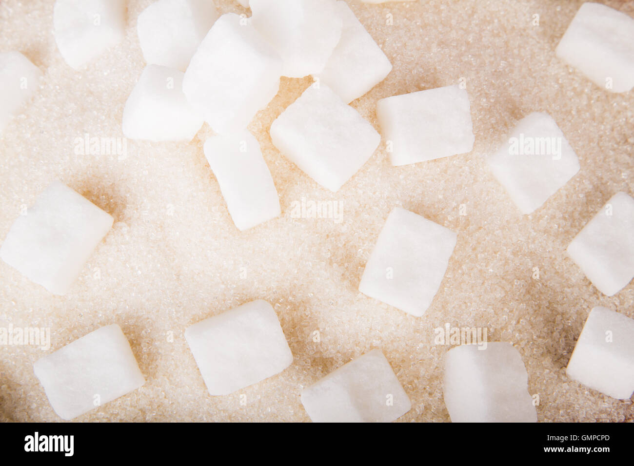 White sugar cubes and crystal sugar Stock Photo - Alamy