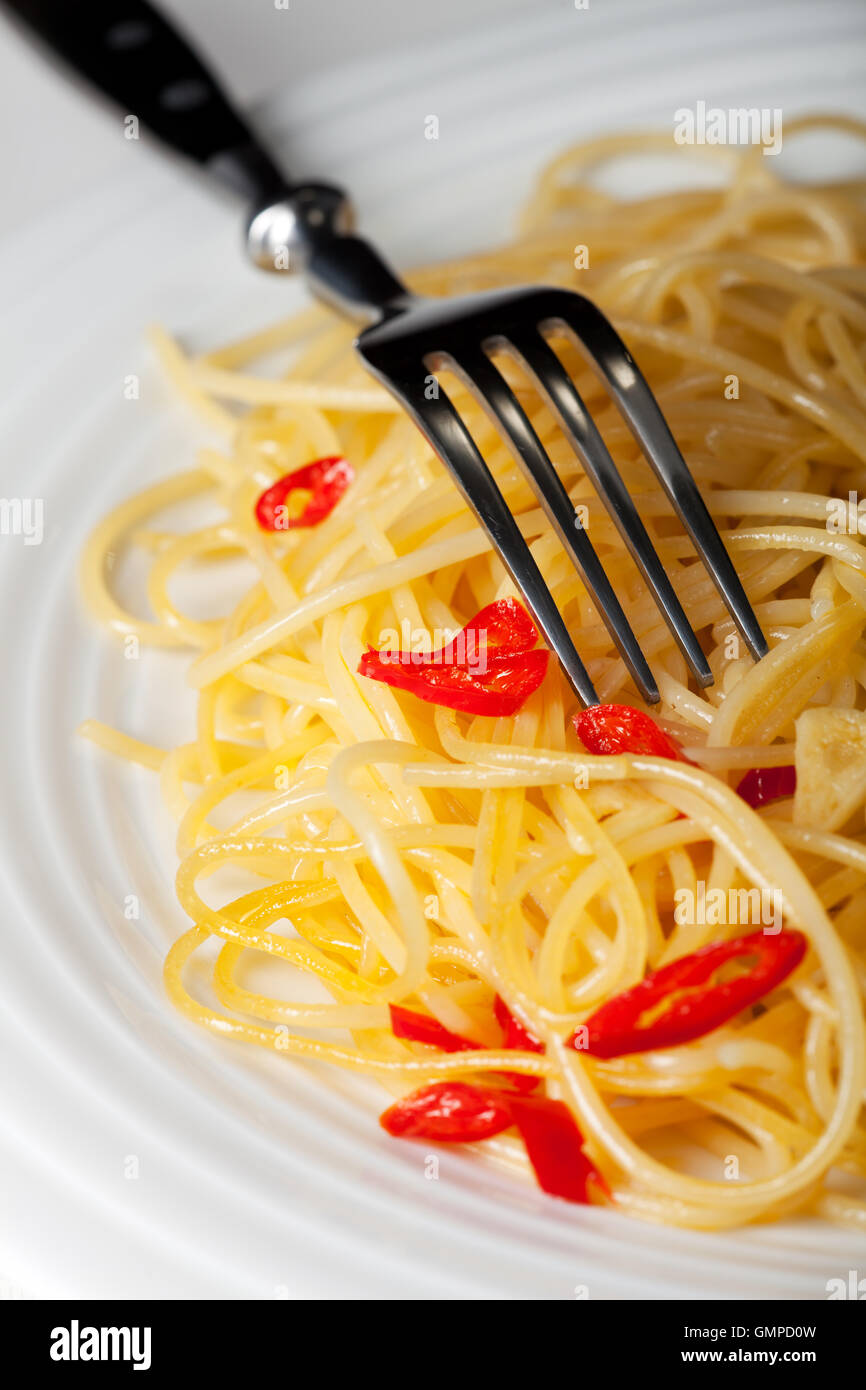 spaghetti alio olio and a fork Stock Photo - Alamy