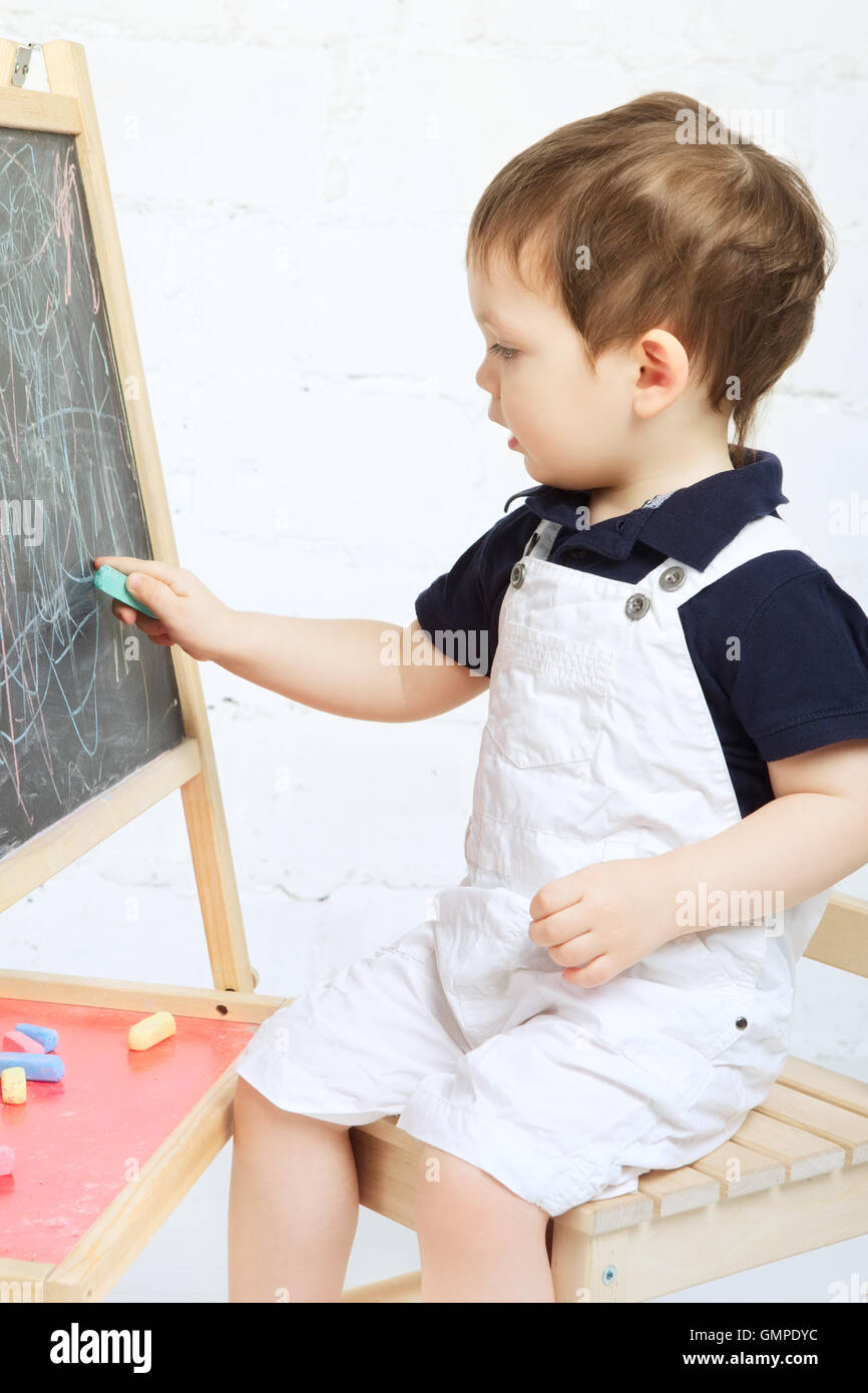 Child Drawing With Chalk Stock Photo - Alamy