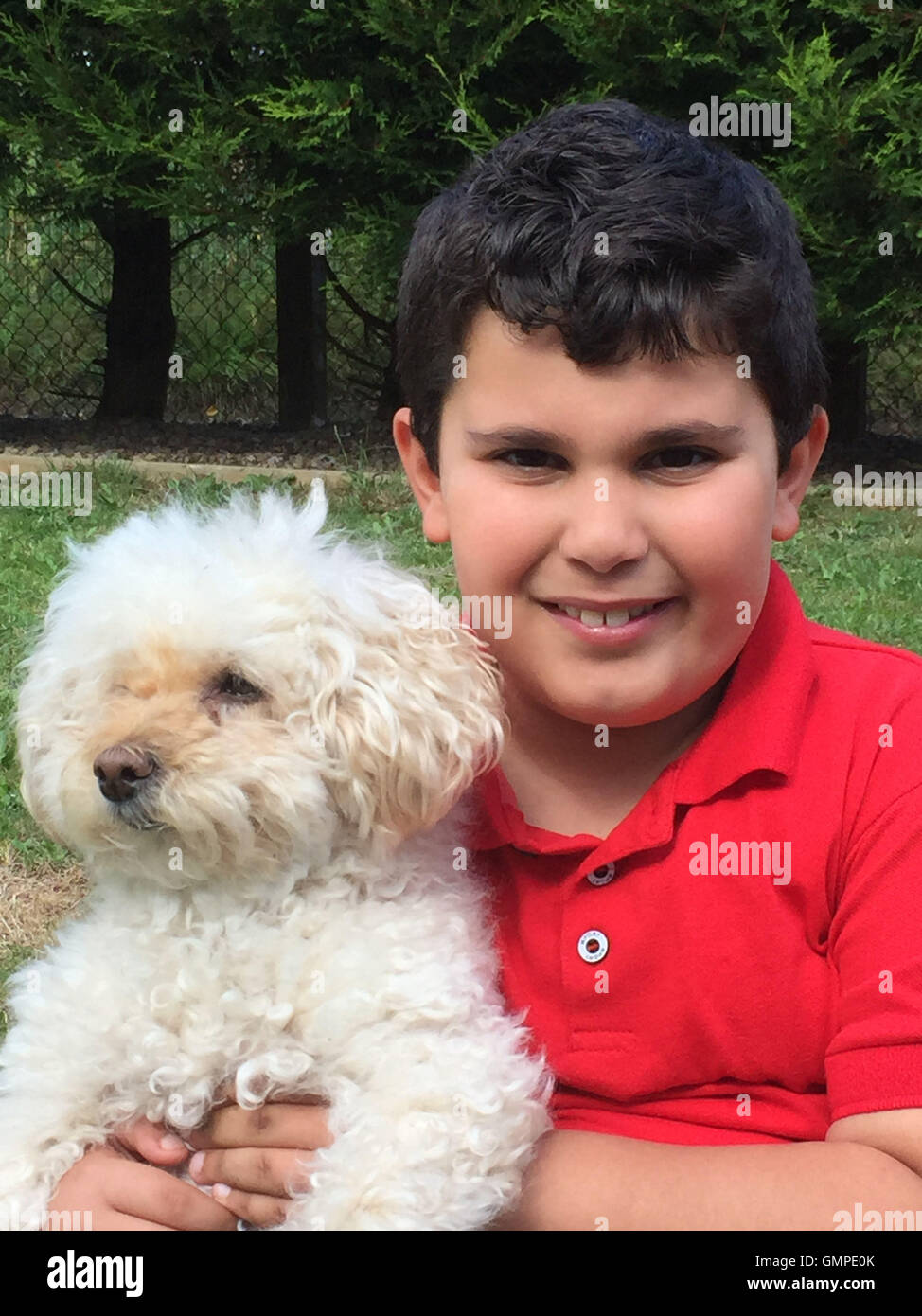 Six year old Sherwyn Sarabi - with his dog Papoo - at home in Catterick ...