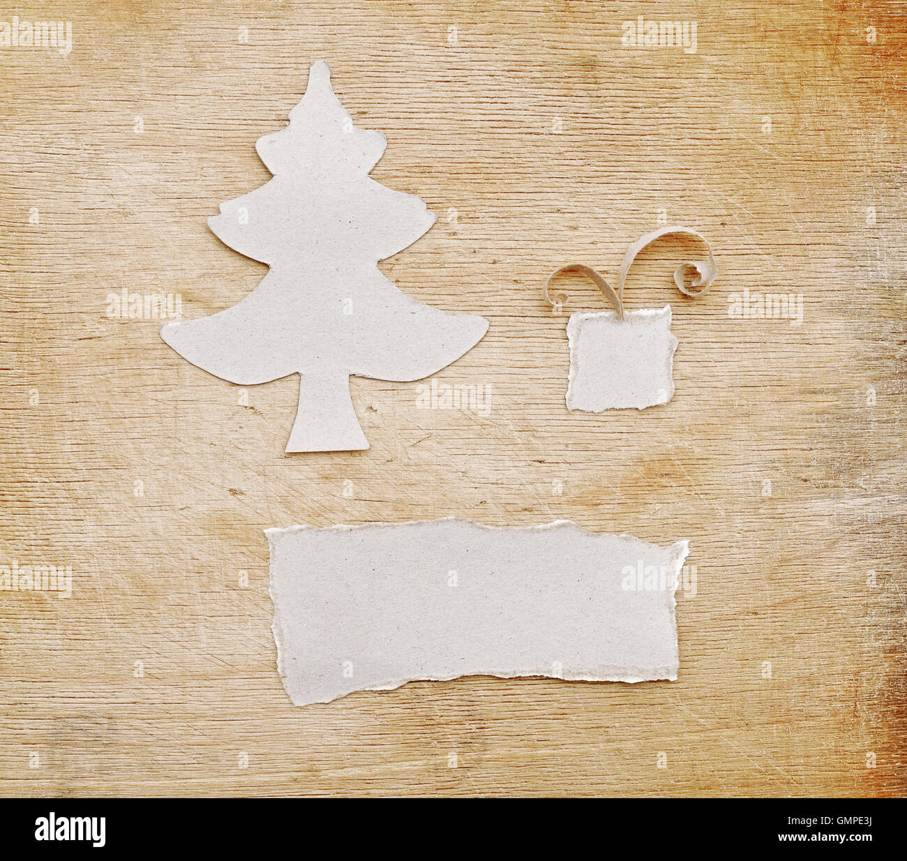 christmas tree made of torn paper on old wood background Stock Photo ...