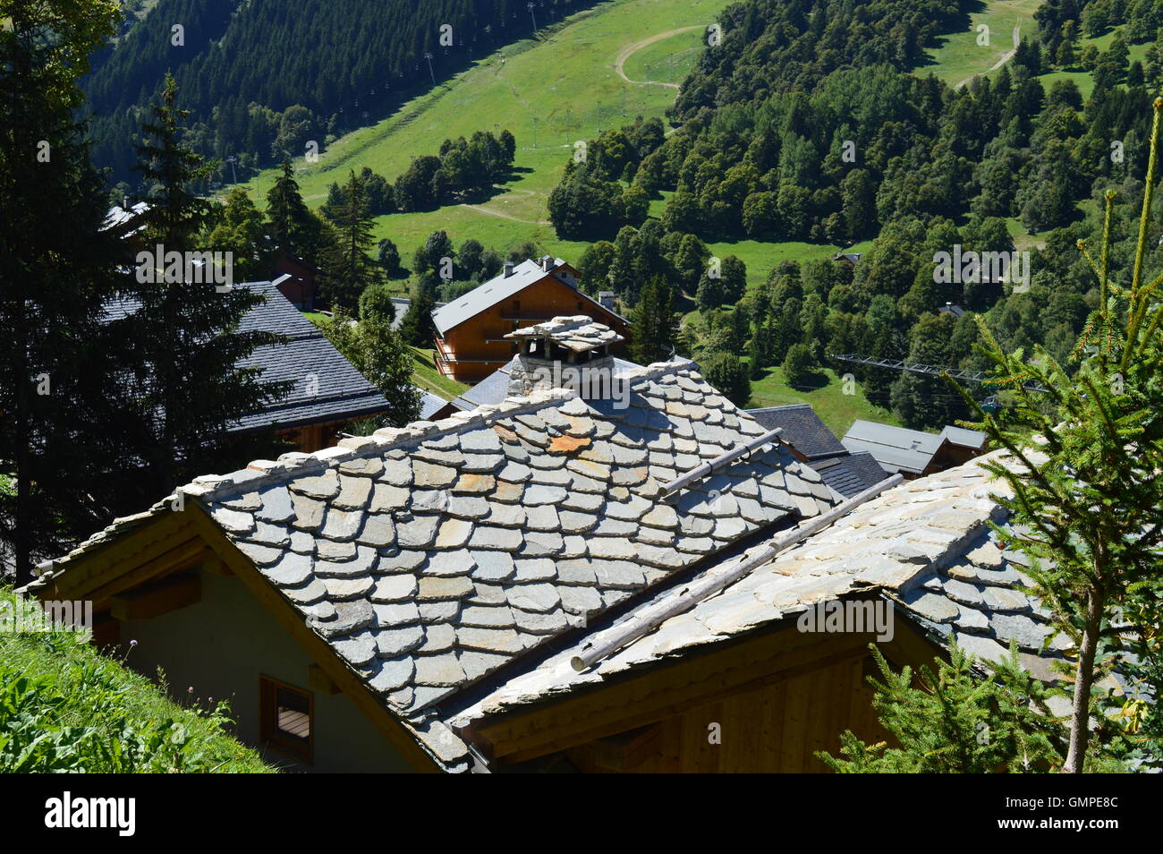 Chalet roof showing natural slate and butterfly formation, in Meribel ...