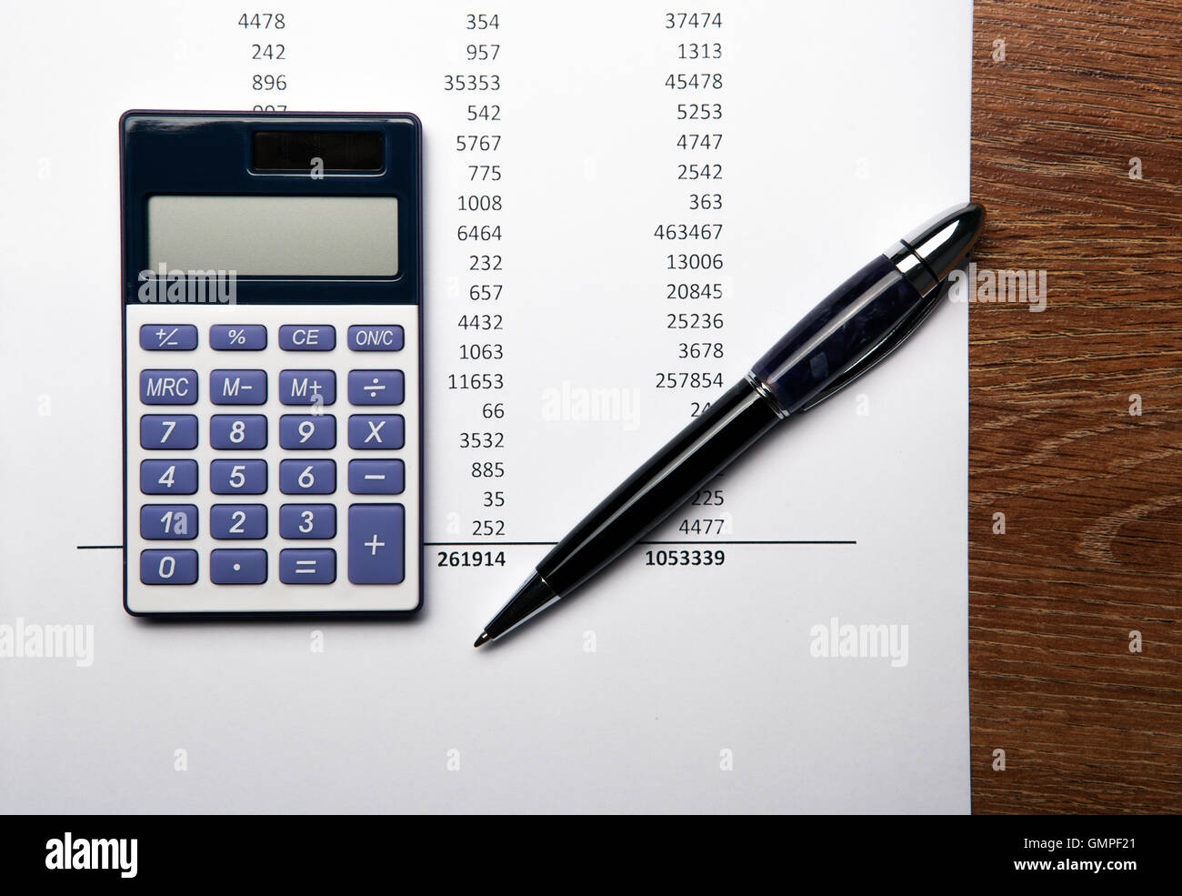 work on the calculator and papers Stock Photo - Alamy