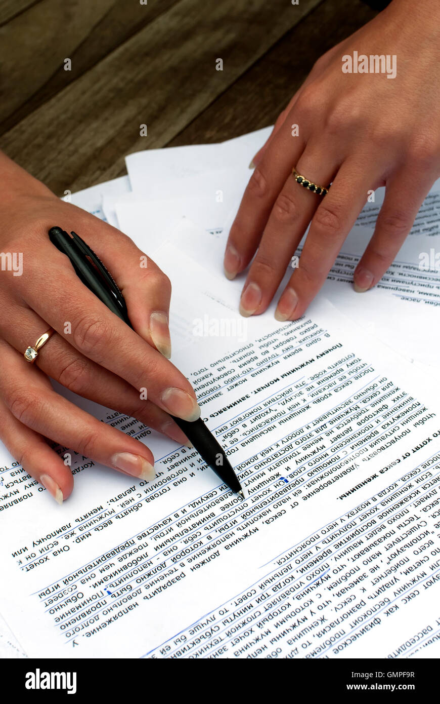 Close-up of female hands working with document Stock Photo - Alamy