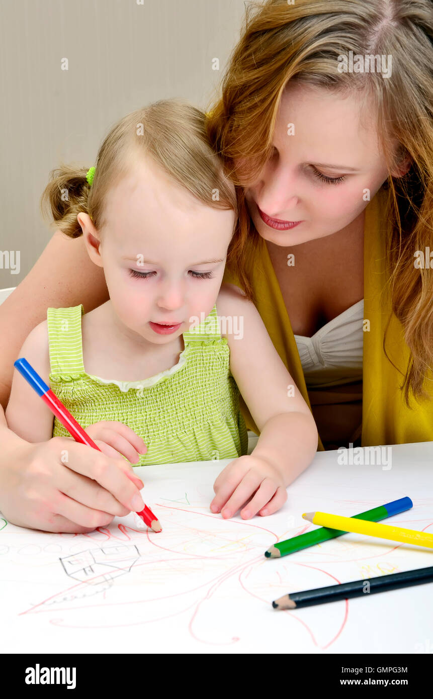 Mother and child painting Stock Photo - Alamy