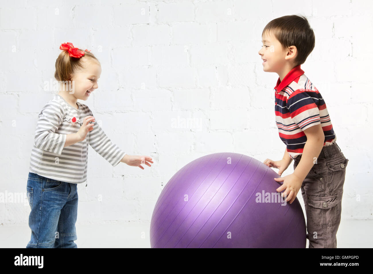 Children With Ball Stock Photo - Alamy