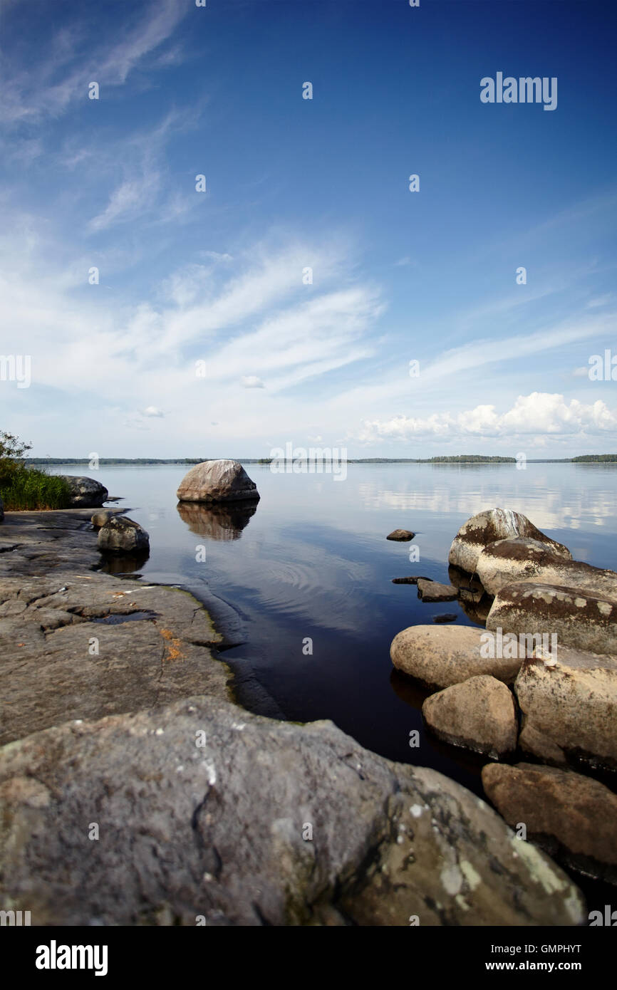 Stone coast of the lake Stock Photo - Alamy