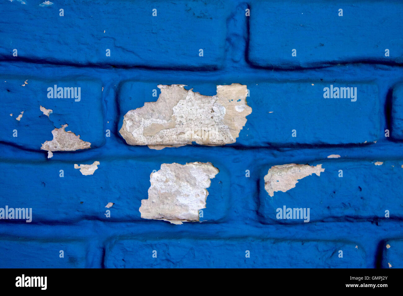 colored and broken blue wall in uruguay Stock Photo - Alamy