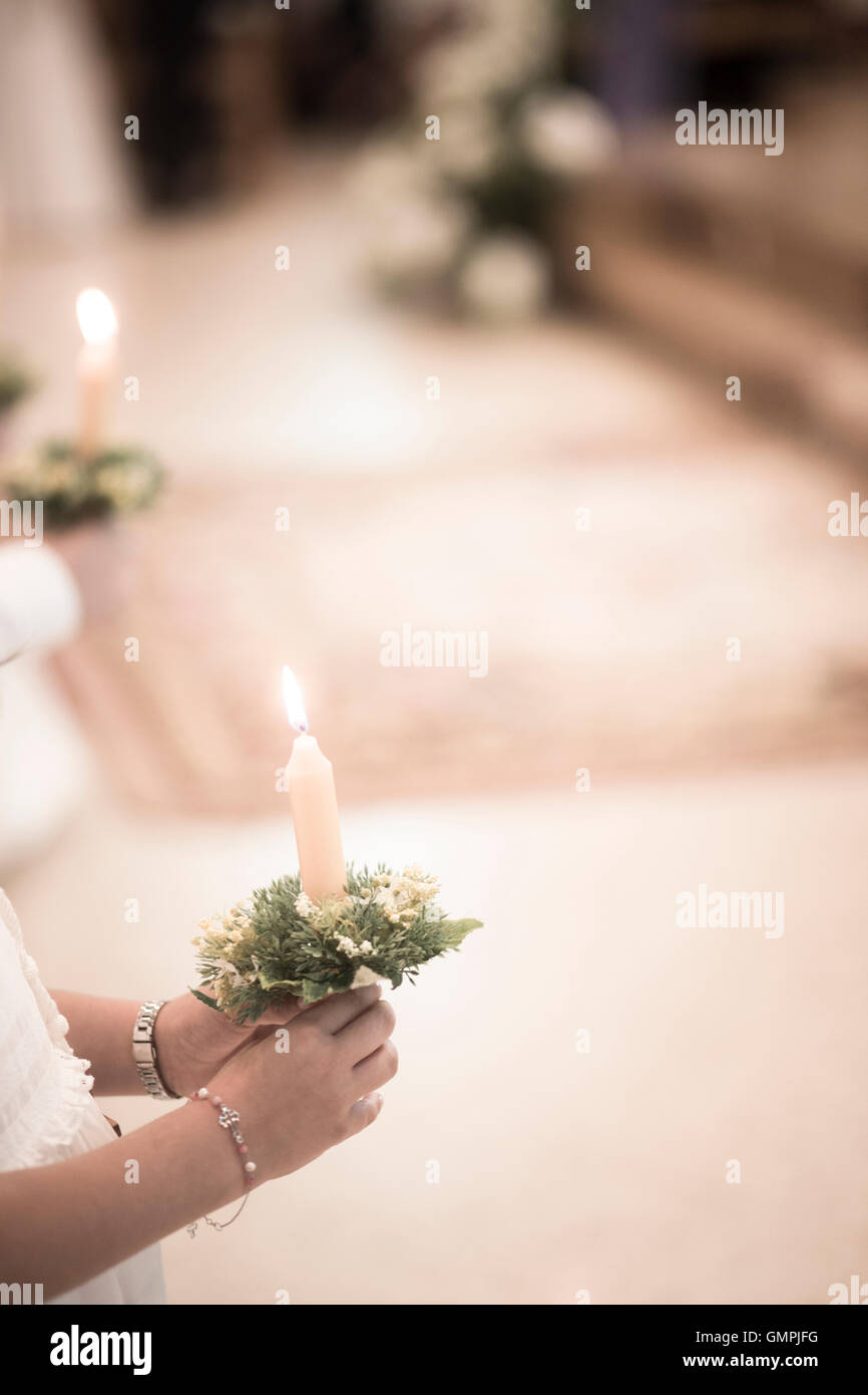 Catholic first communion religious ceremony girl in white dress holding ...
