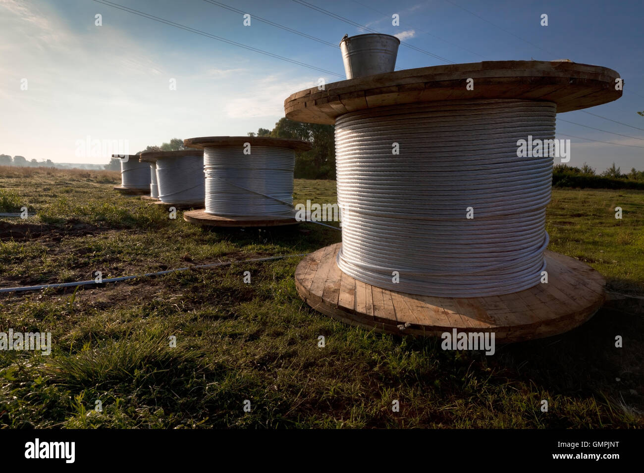 Bobbins with electric power wire Stock Photo - Alamy