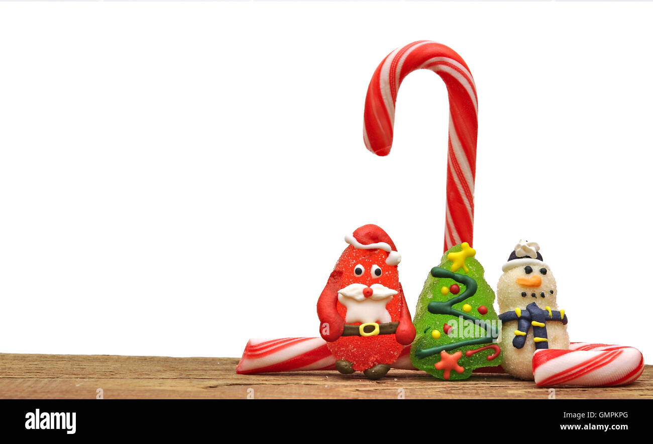 Candy canes and christmas toys over white Stock Photo - Alamy
