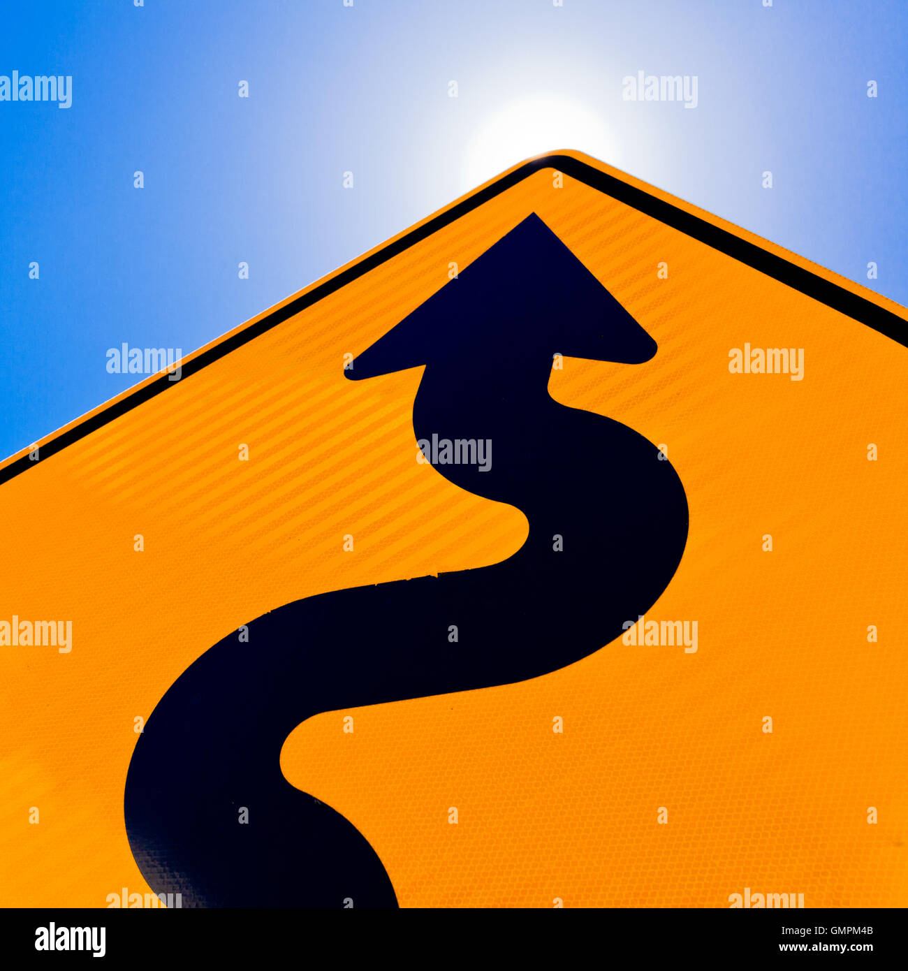 Wavy arrow on road sign pointing up for success Stock Photo - Alamy