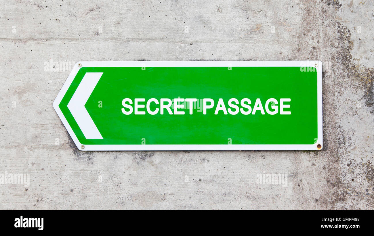 Green sign - Secret passage Stock Photo - Alamy