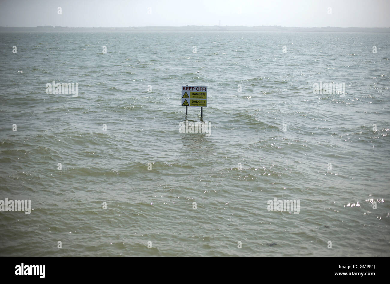 A deep water danger warning sign in the River Thames, off the coast of ...