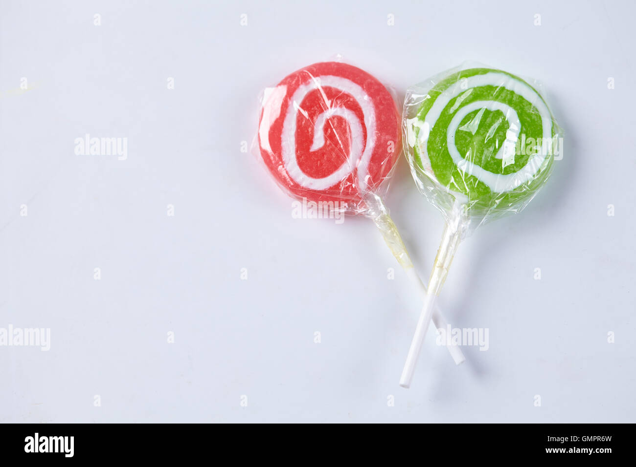 candy on a stick on a white background Stock Photo - Alamy