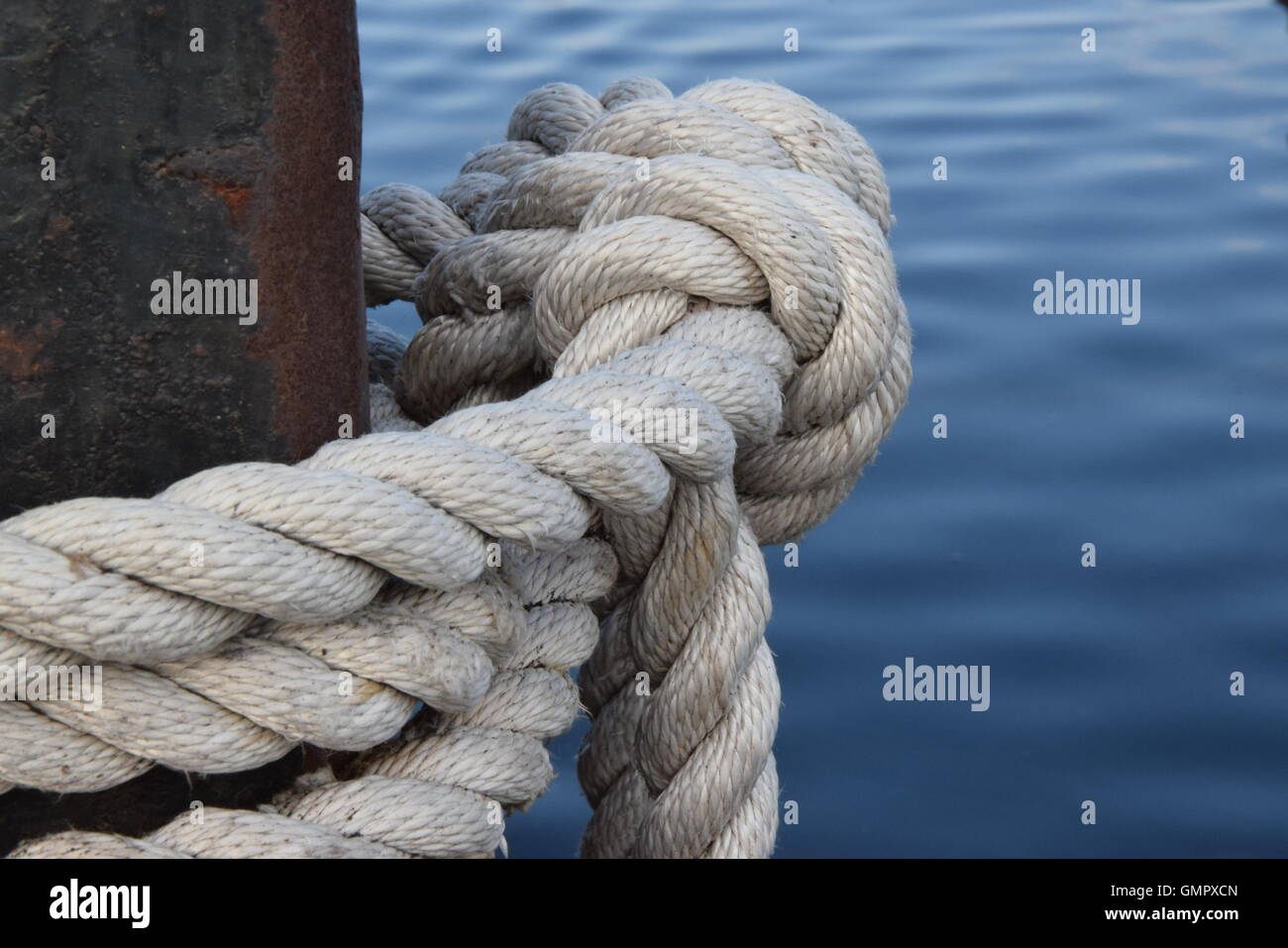 Front view of rope to tie the boat against sea background, space for ...