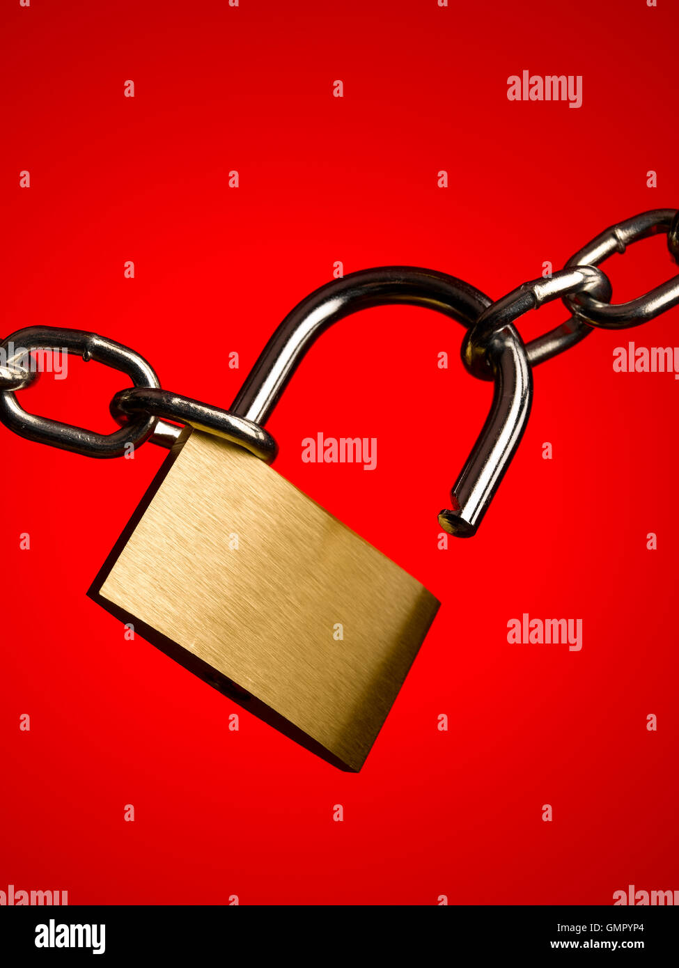 Padlock and chain on red Stock Photo - Alamy