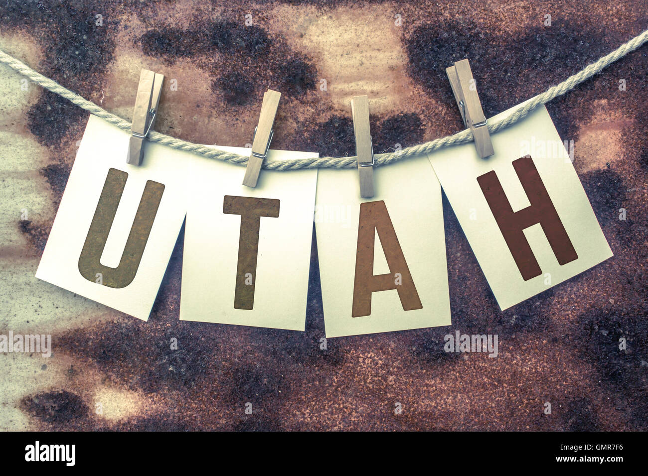 The word "UTAH" stamped on cards and pinned to an old piece of twine ...