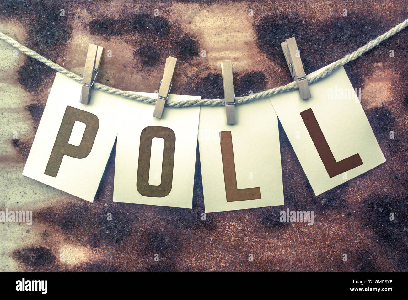 The word "POLL" stamped on cards and pinned to an old piece of twine ...