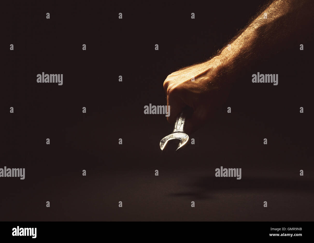 Conceptual composition, man's hand holding a key tool, number 22, made ...