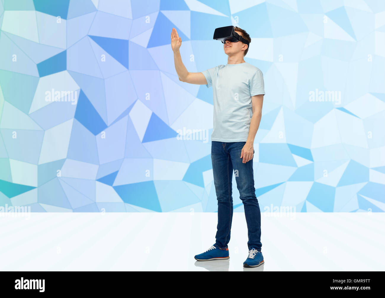 happy man in virtual reality headset or 3d glasses Stock Photo - Alamy