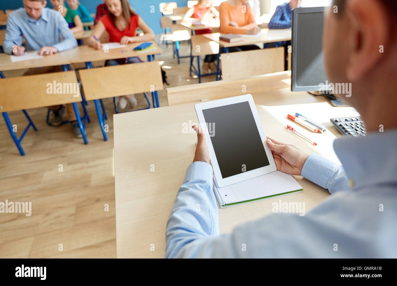 students and teacher with tablet pc at school Stock Photo - Alamy