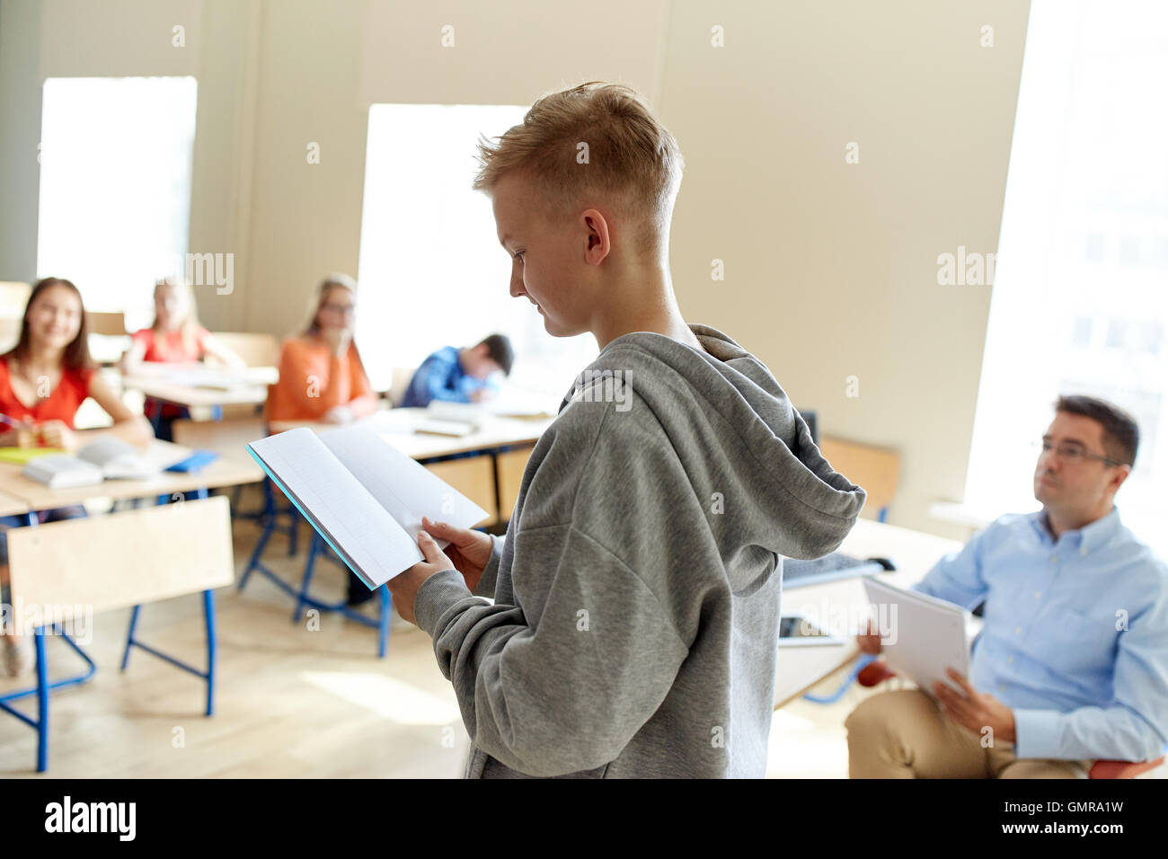 Boy Student Reading Report Class High Resolution Stock Photography and ...